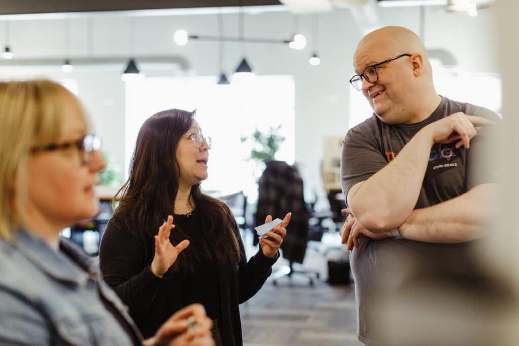 Pictured is author Jing Fan chatting with co-workers about Roborazzi.